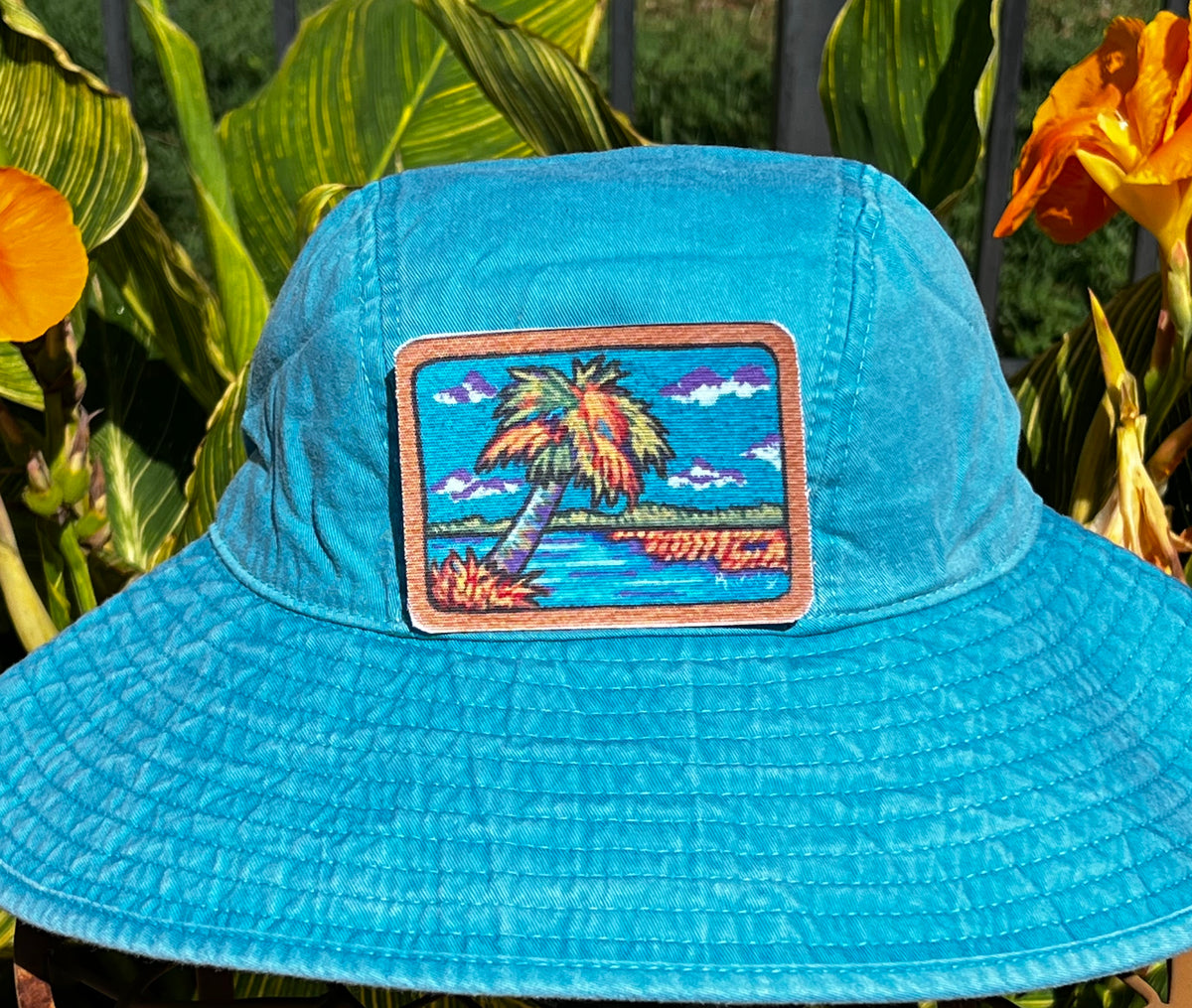 Rural Heart®️ by René Earnhardt “Palm Tree” bucket hat featuring origi